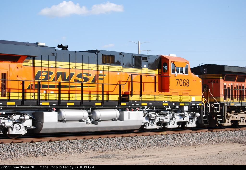 BNSF 7068 passes me as she slows down for a crewchange at the BNSF Amarillo Depot a 1/4 mile ahead.